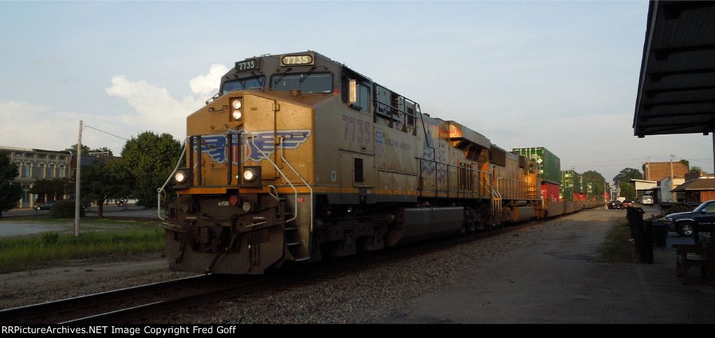 UP 7735 Westbound chasing the sun.